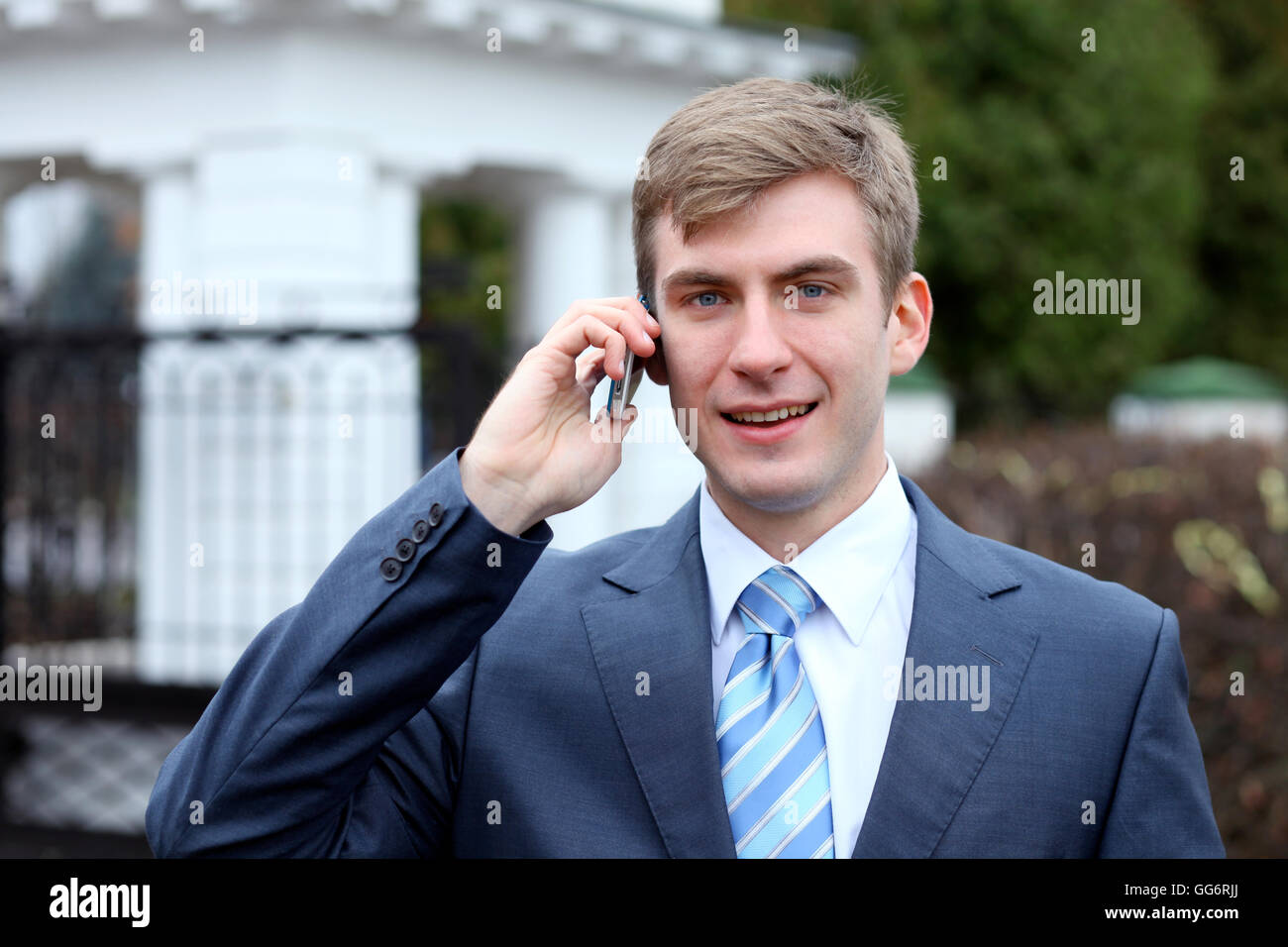 Portrait of young attractive man calling by phone Stock Photo - Alamy