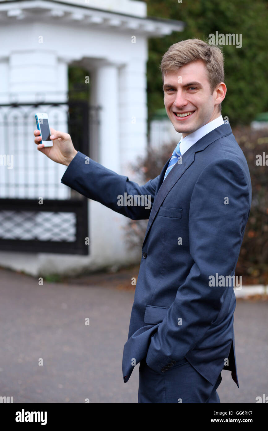 Portrait of young attractive man calling by phone Stock Photo - Alamy