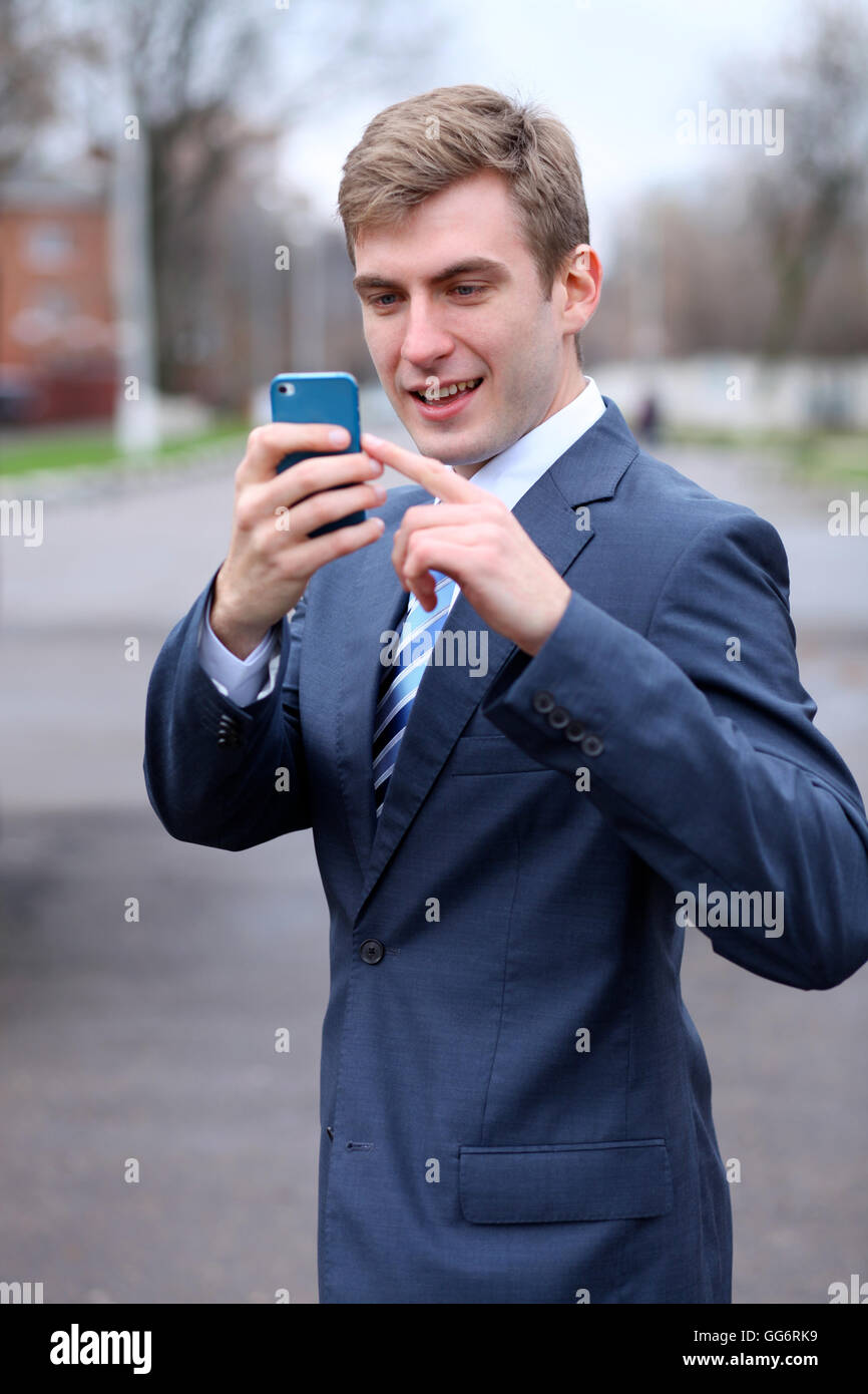 Portrait of young attractive man calling by phone Stock Photo - Alamy