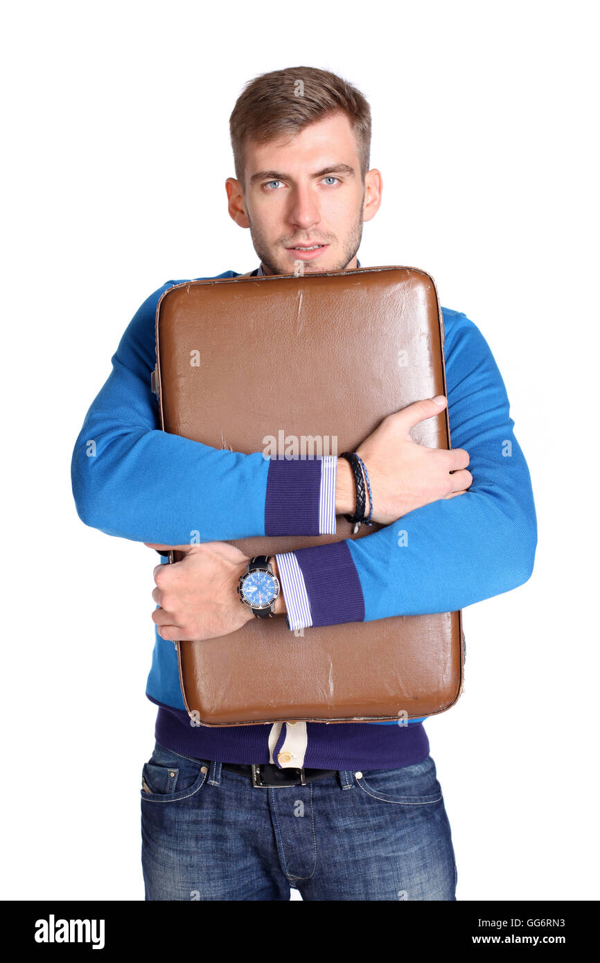 Young man holding suitcase hi-res stock photography and images - Alamy