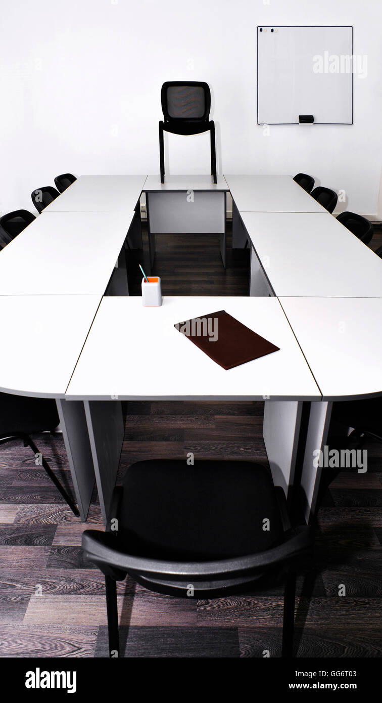 Empty meeting room in the office with tables and chairs Stock Photo - Alamy