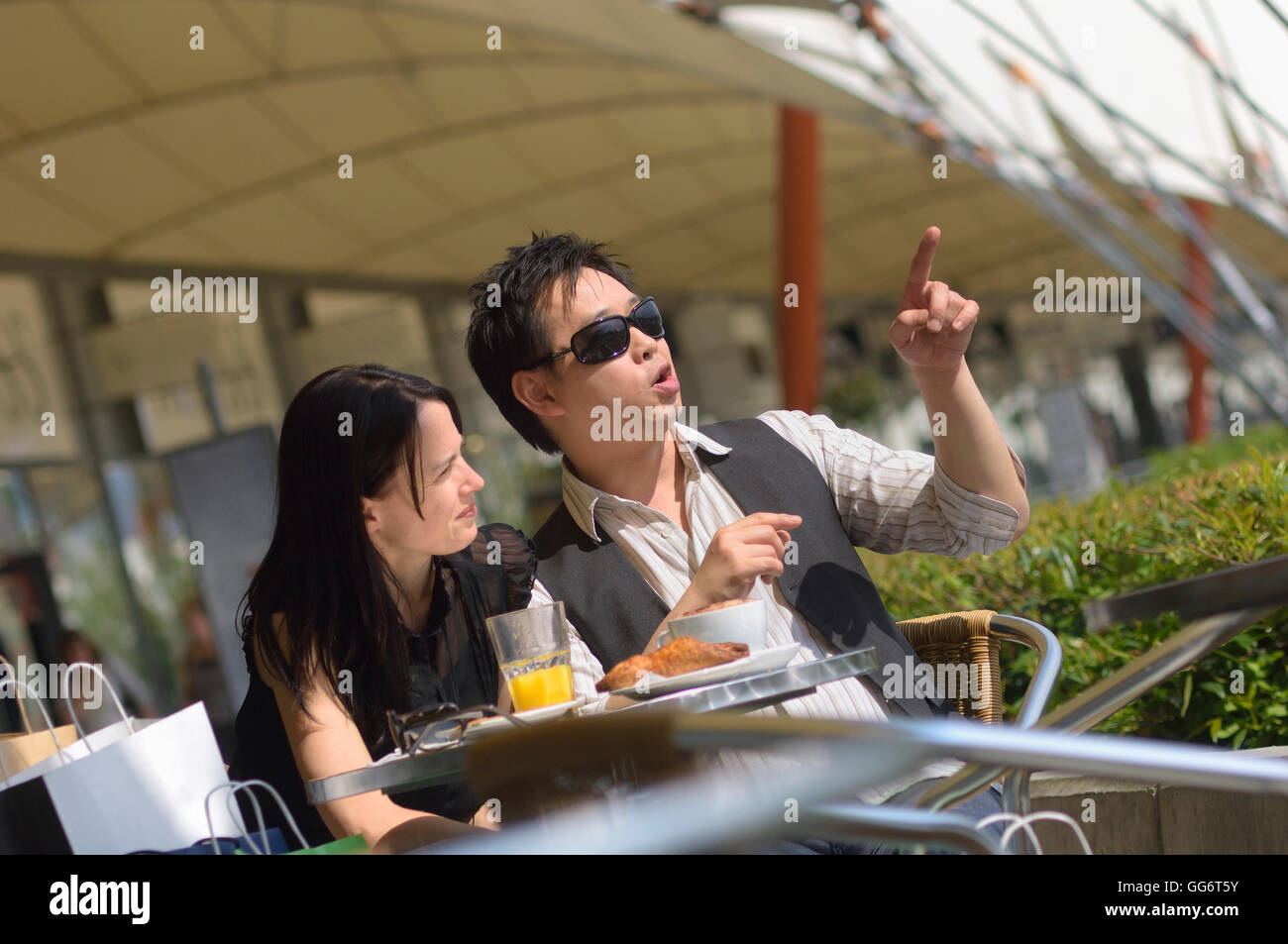 Young adult couple having brunch at a retail outlet. England. UK Stock ...