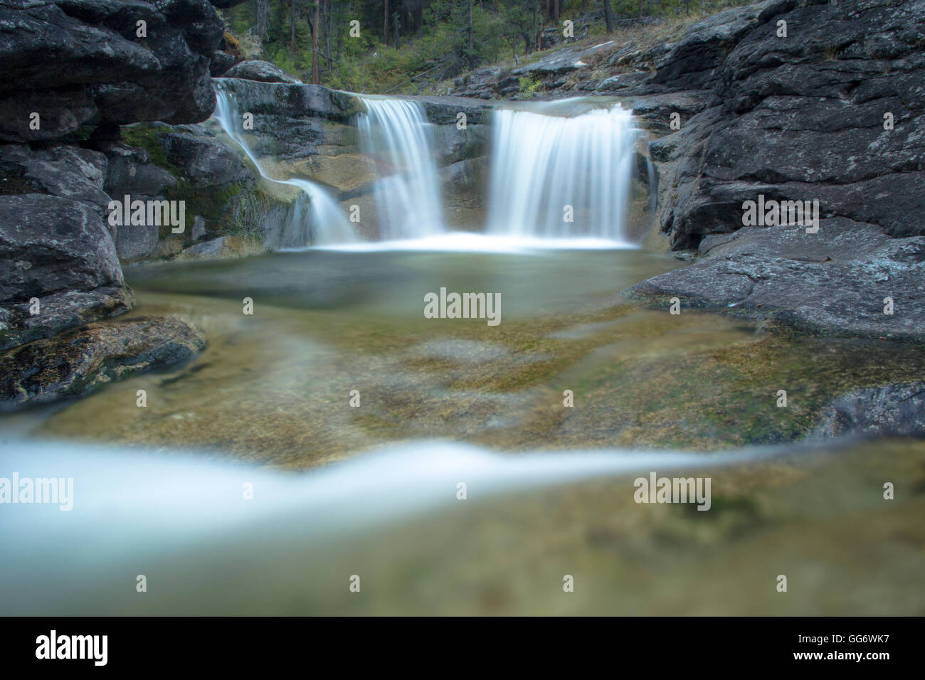 Waterfall in mountain wilderness Stock Photo - Alamy