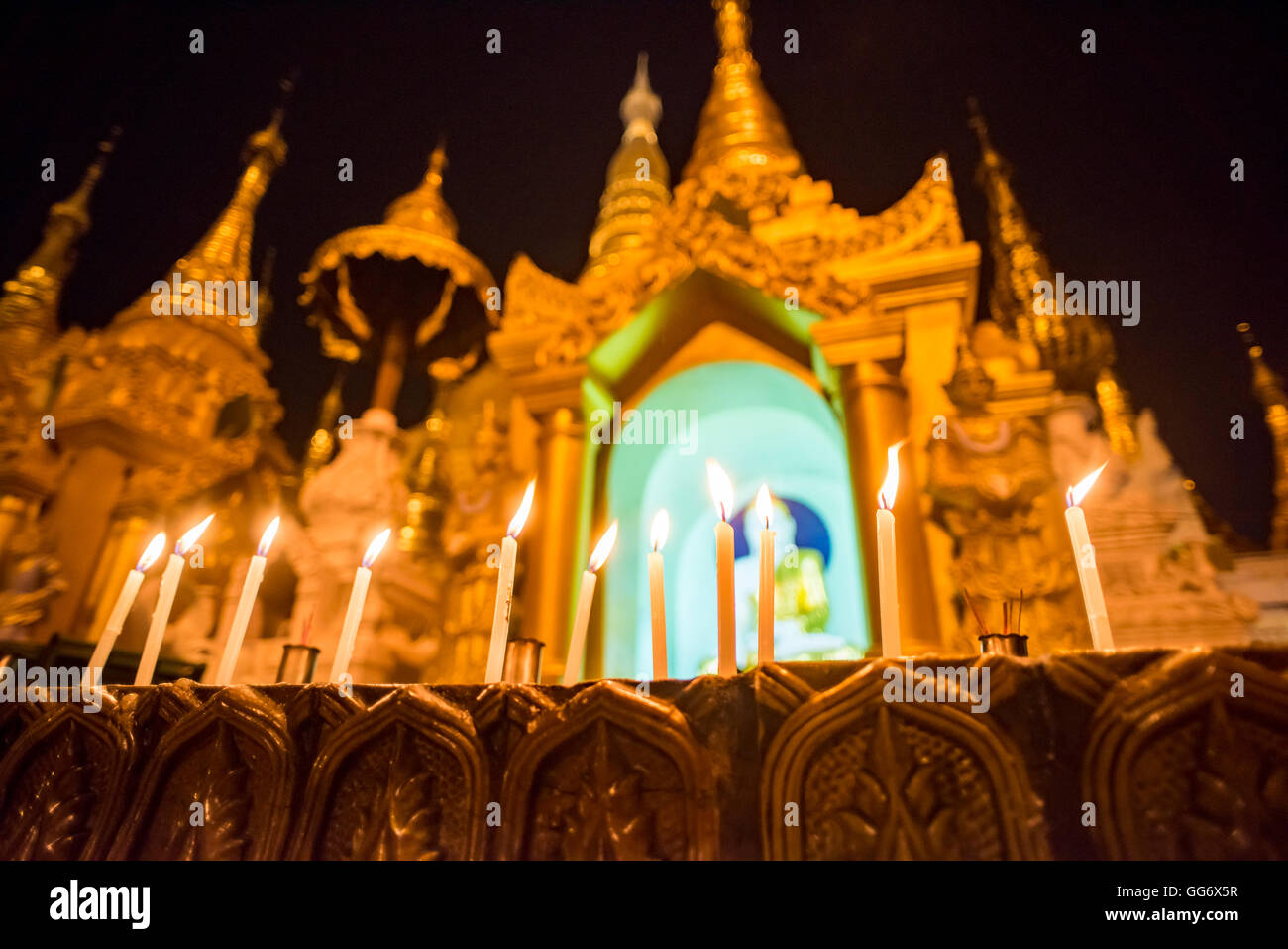 Lighten up candles at the Shawedagon Pagoda, Yangon, Myanmar Stock ...