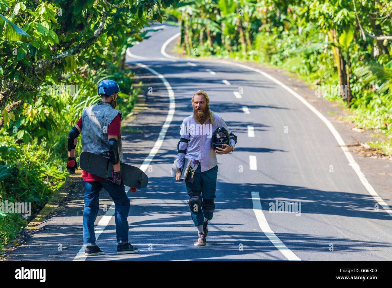 Two longboard skateboarders in action Stock Photo - Alamy