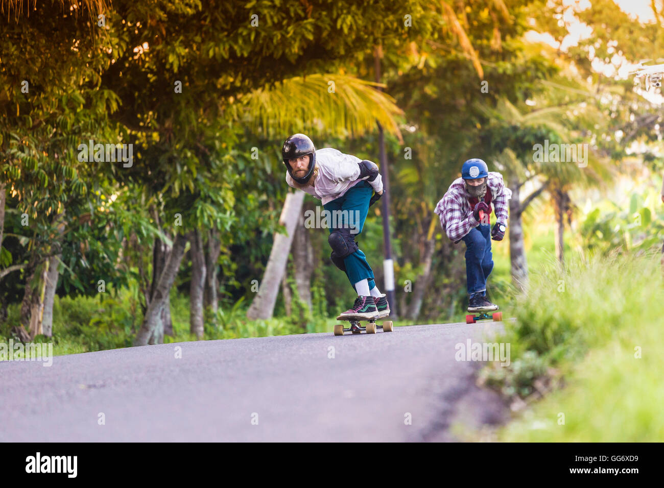 Two longboard skateboarders in action Stock Photo - Alamy
