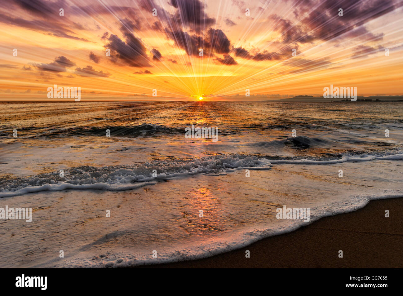 Ocean sunset sun rays is a colorful ocean scenic with sun beams ...