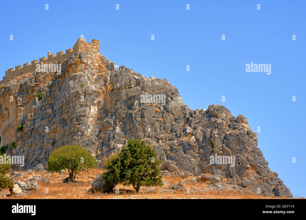 Medieval fortifications on top of the rock in Lindos Stock Photo - Alamy