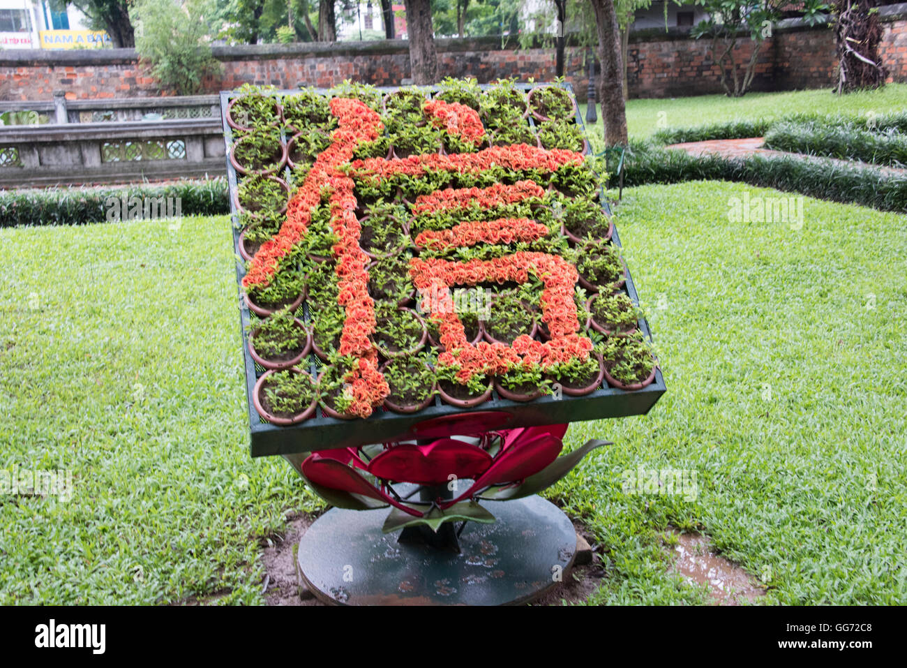 Vietnamese character formed from plants in pots at temple in Hanoi ...