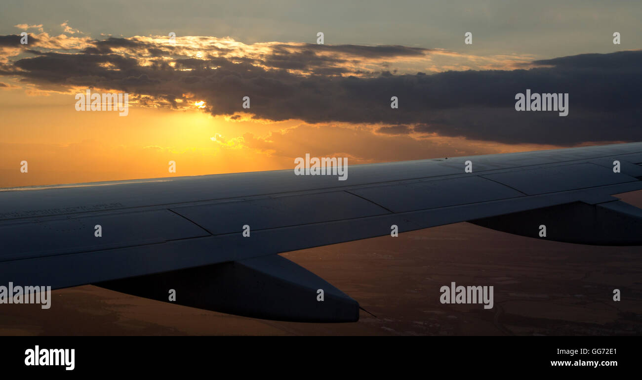 sunset on aircraft wing view from the plane Stock Photo - Alamy