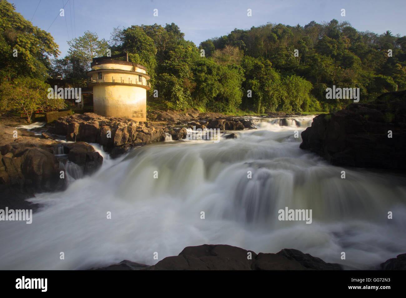 Morning hues at Perunthenaruvi waterfalls on the banks of the Pamba ...
