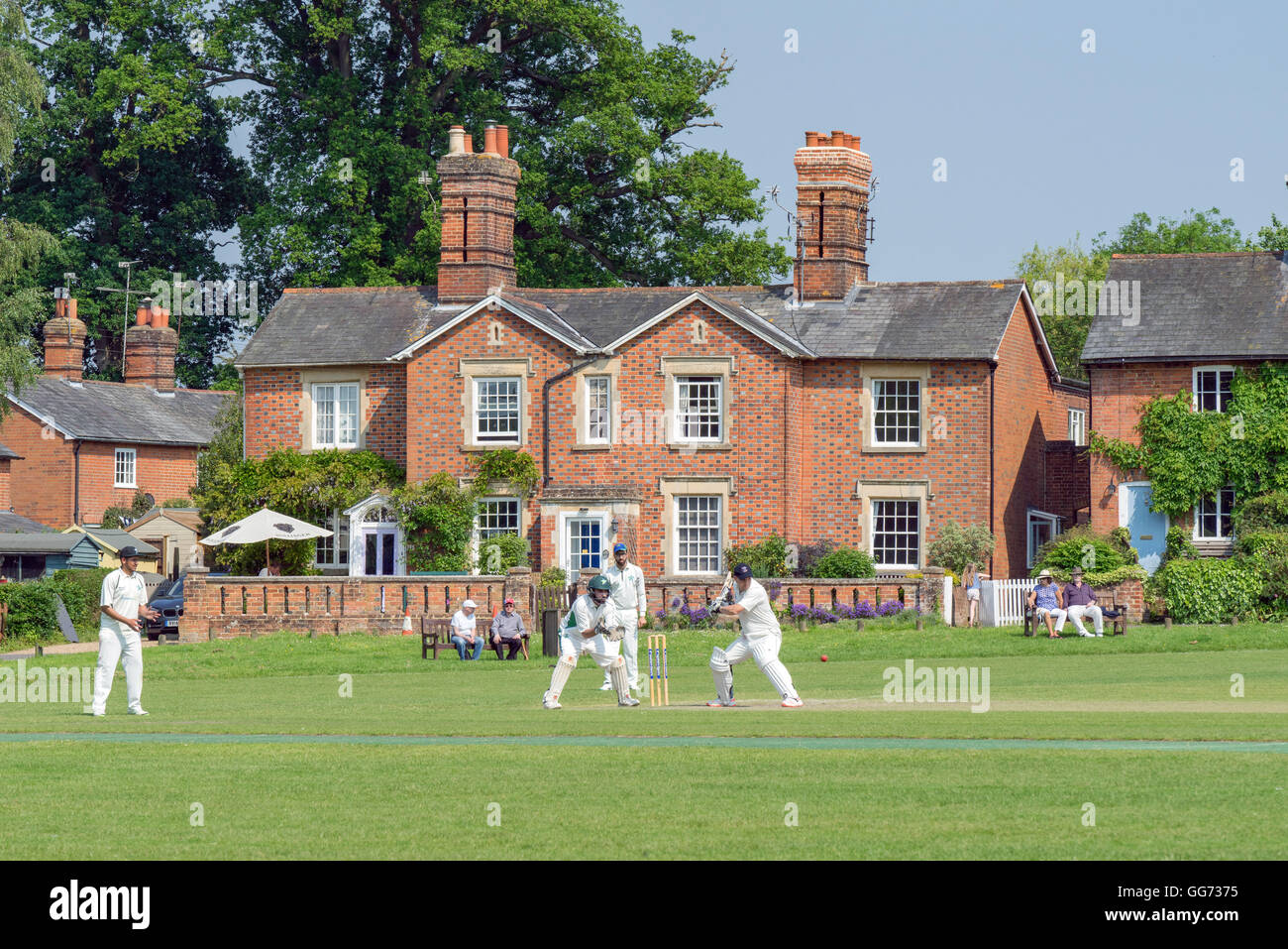 Village cricket being played on the green at Hartley Wintney in ...