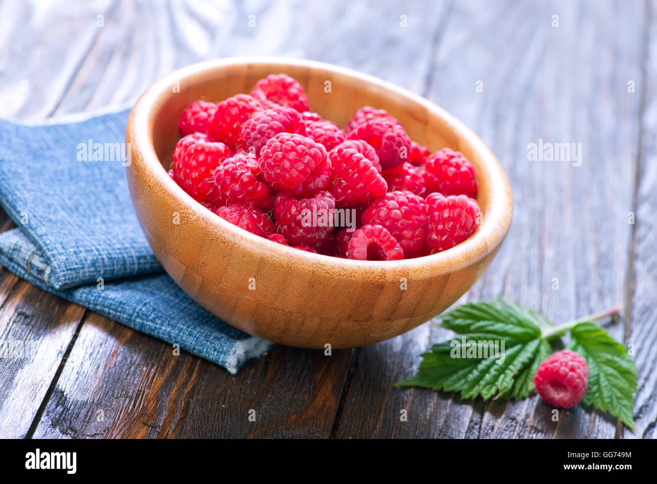 raspberry in bowl and on a table Stock Photo - Alamy