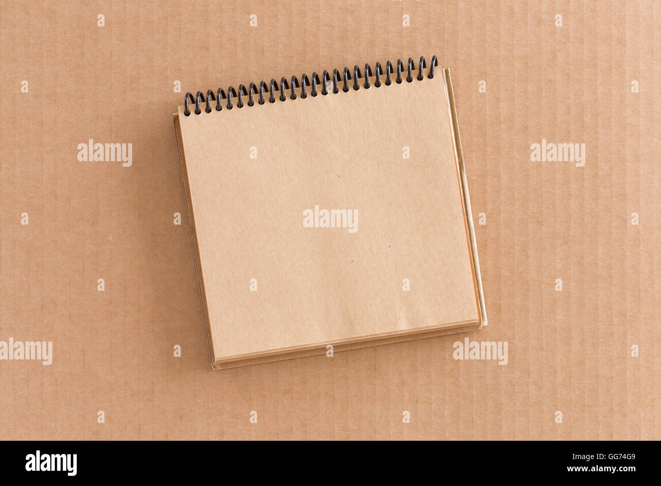 Brown cardboard notepad on corrugated cardboard background Stock Photo ...