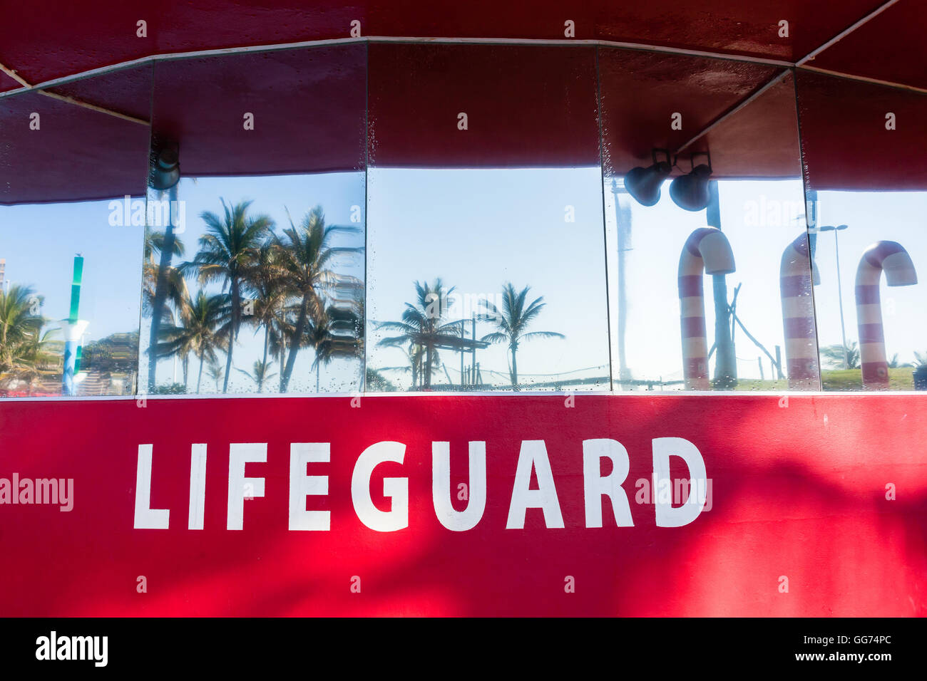 Lifeguard lookout tower office red building on beach ocean pools with ...