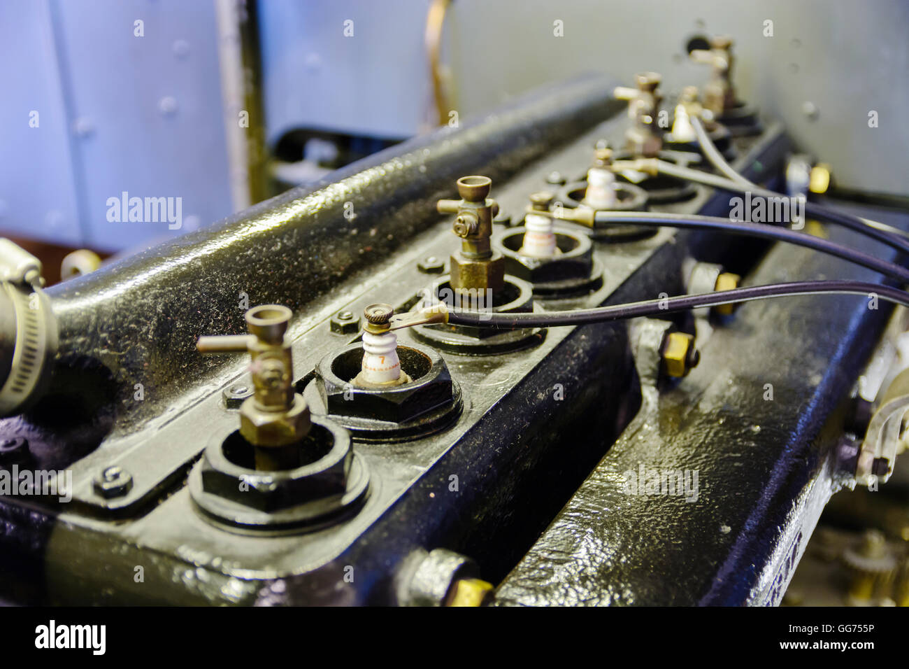 Spark plug in the old engine Stock Photo - Alamy