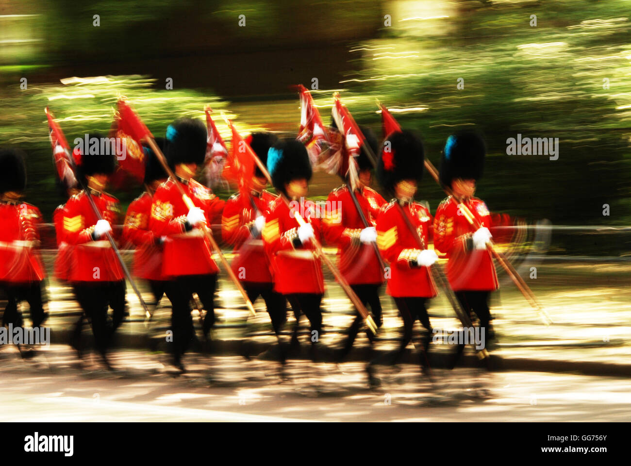 Guards marching near Buckingham Palace carrying the Colours ...