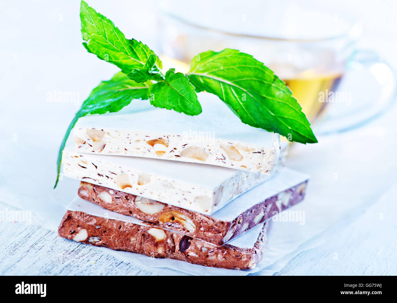 sweet nougat with nut on white paper Stock Photo - Alamy