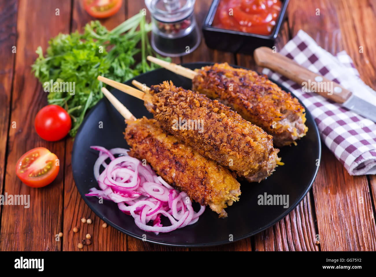 fried kebab with spice and fresh tomato Stock Photo - Alamy