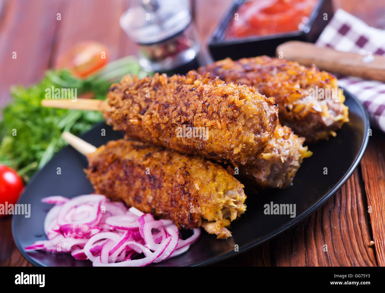 fried kebab with spice and fresh tomato Stock Photo - Alamy