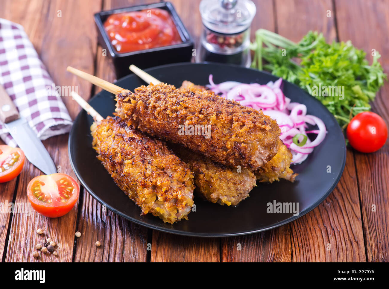 fried kebab with spice and fresh tomato Stock Photo - Alamy