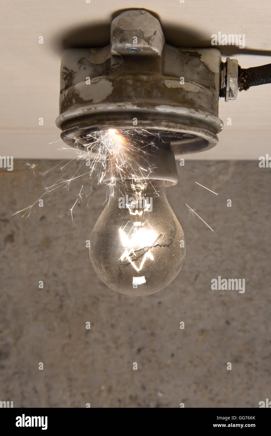 Old lamp with a circuit problem starting a fire Stock Photo - Alamy