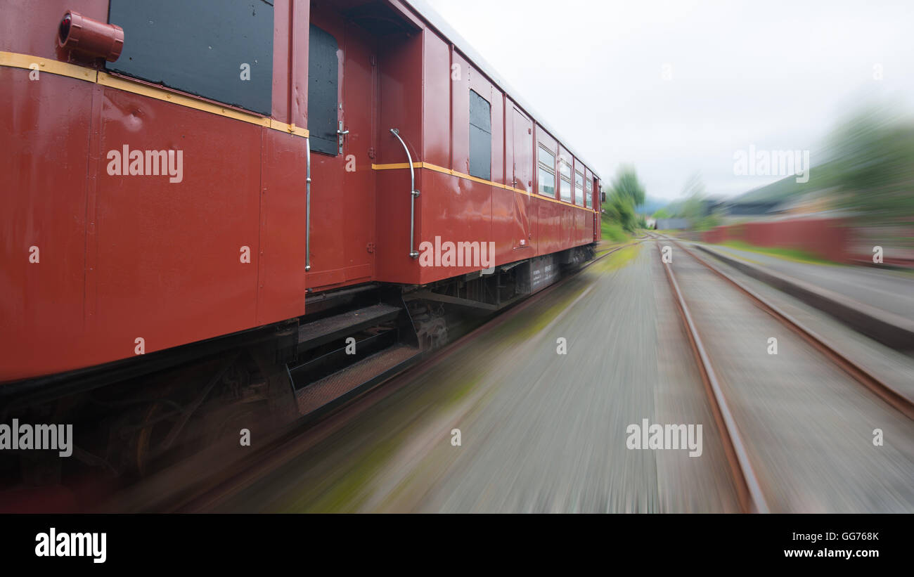 A red old vintage train in speed Stock Photo - Alamy