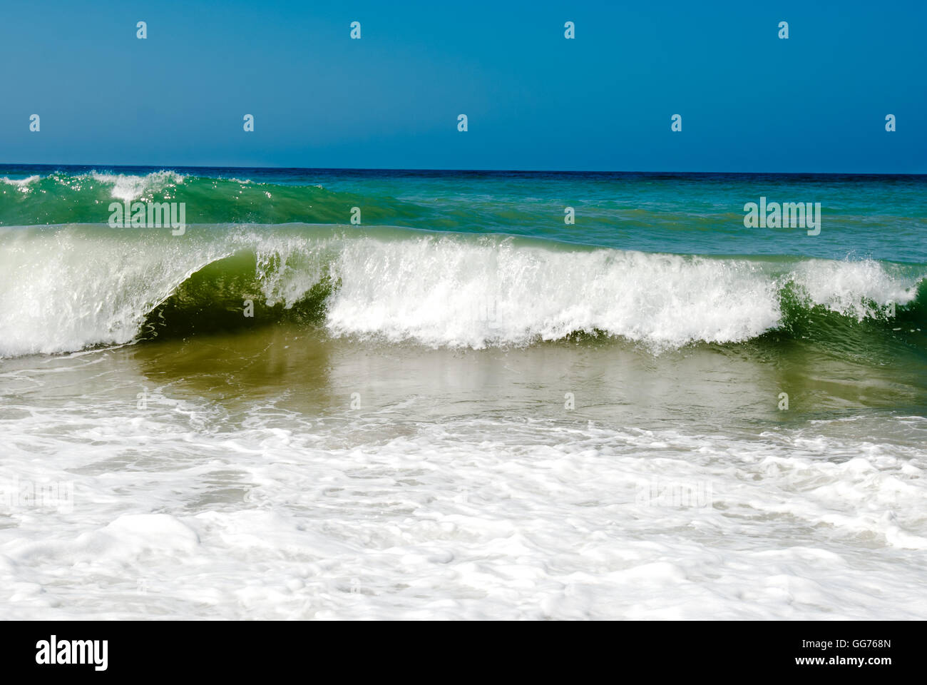 Waves on the beach in beautiful Crete Stock Photo - Alamy