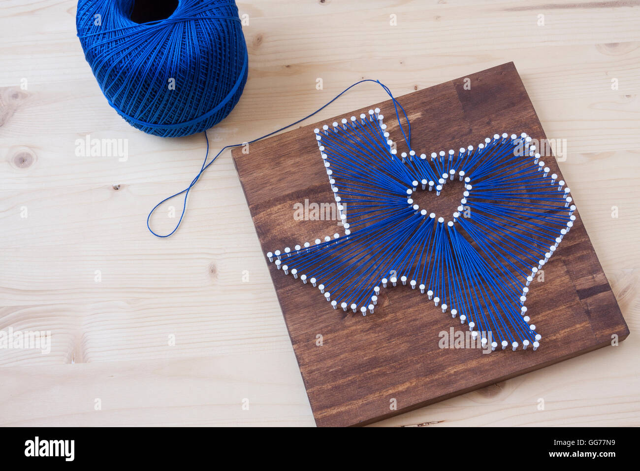 String art in the shape of Texas on a wooden background Stock Photo - Alamy