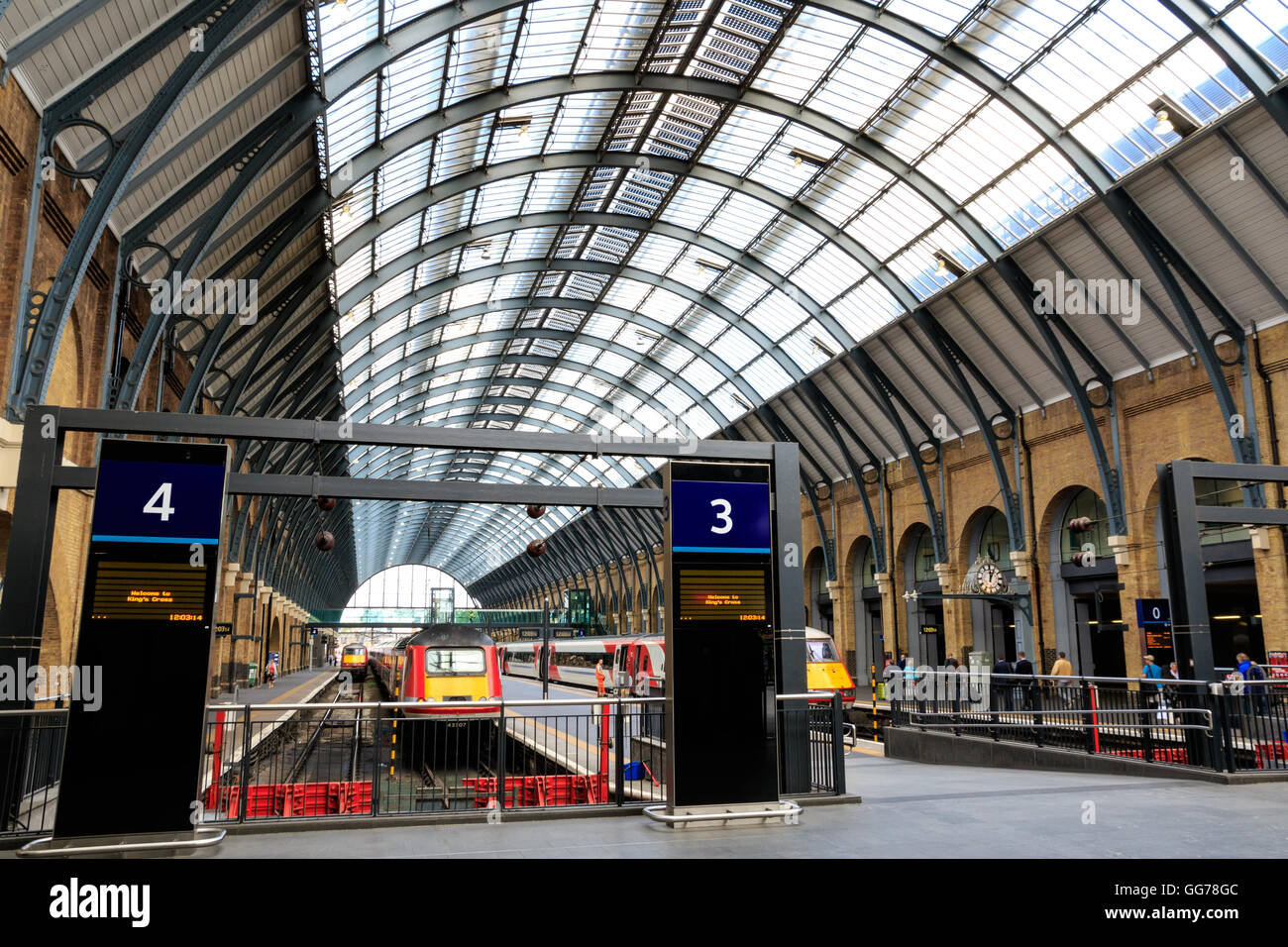 Trains stop at the platforms in Kings Cross train station Stock Photo ...