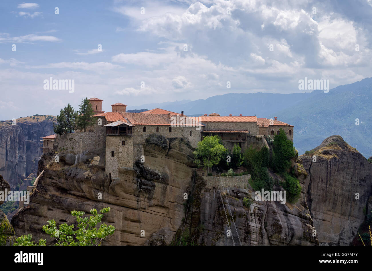 Amazing scenery with a monastery on top of a huge rock in Meteora ...