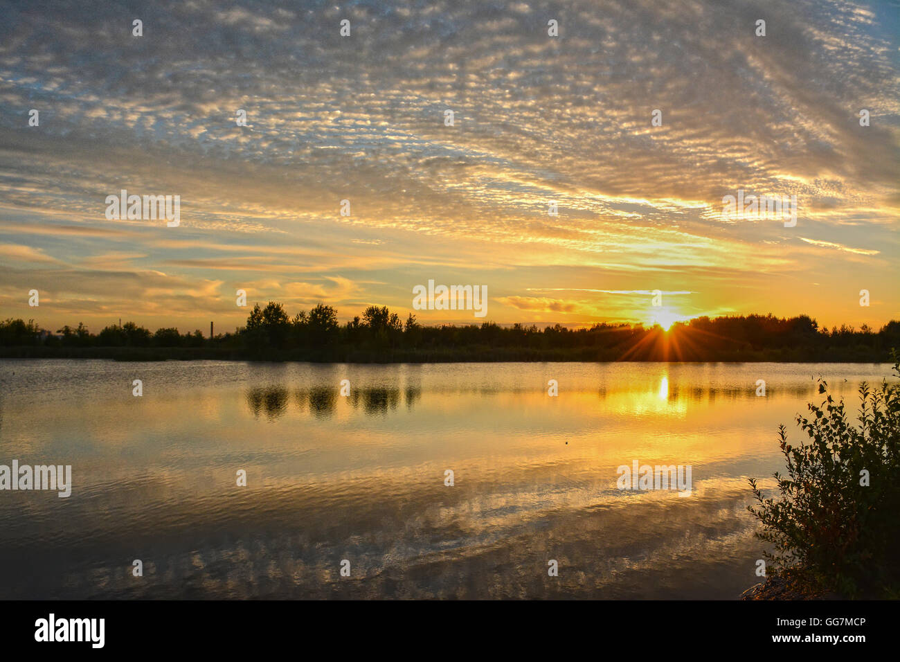 The first rays of the sun in the sky Stock Photo - Alamy
