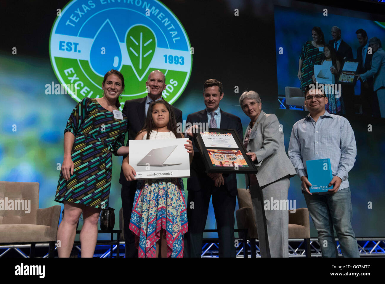 Texas Environmental Excellence Award winners pose on stage with members ...