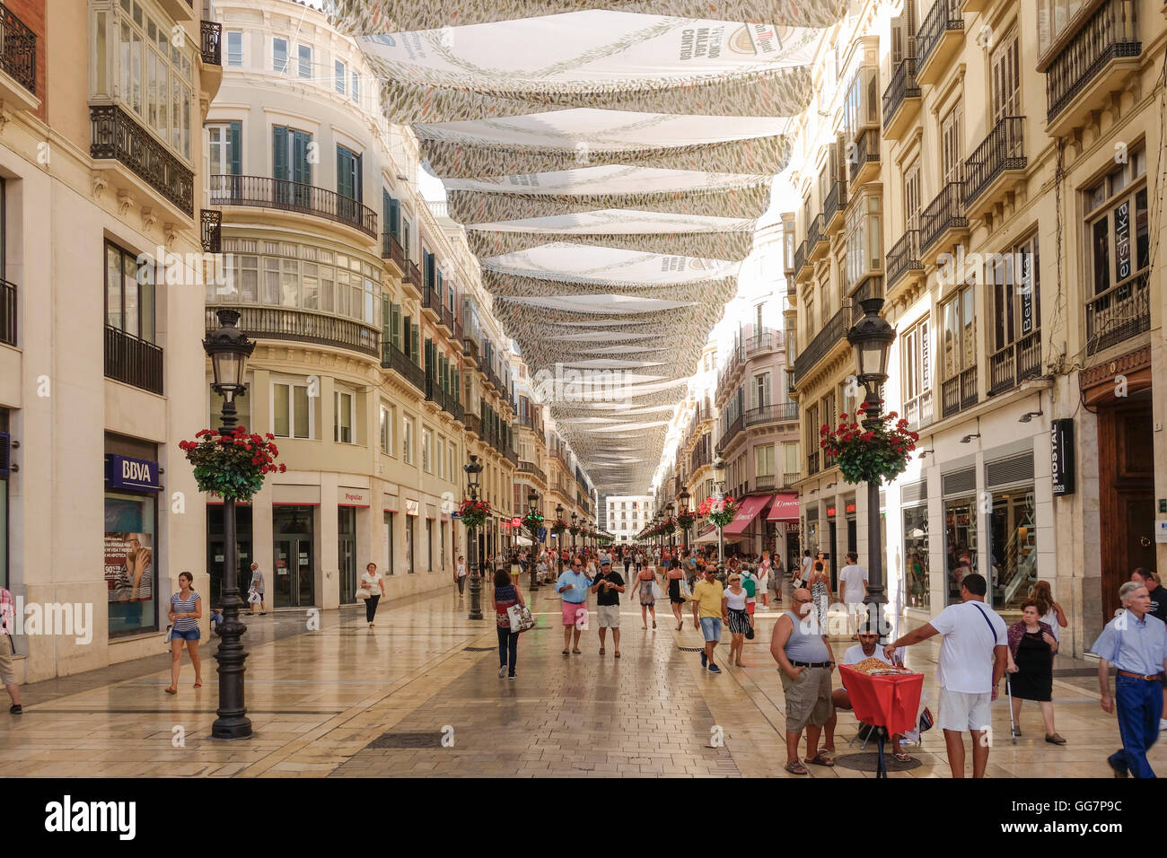 Calle Marqués de Larios Malaga pedestrian main street, covered with sun ...