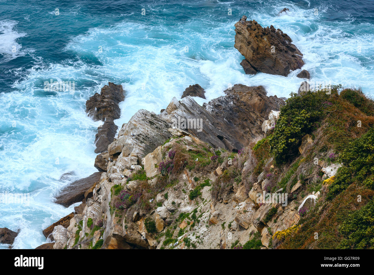 Waves breaking on rocky coast. View from above Stock Photo - Alamy