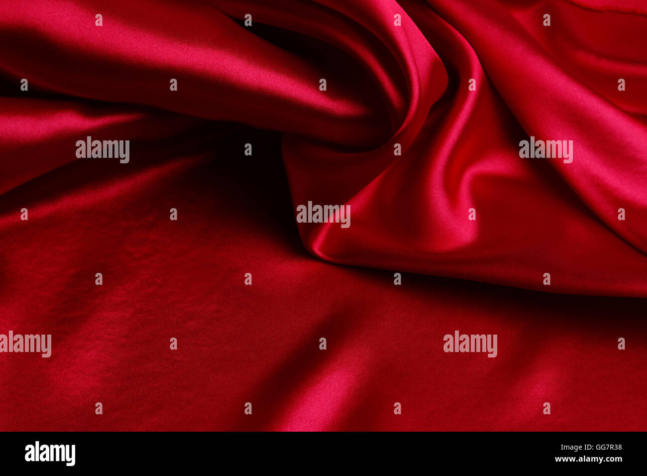 Closeup of ripples in red silk fabric Stock Photo - Alamy