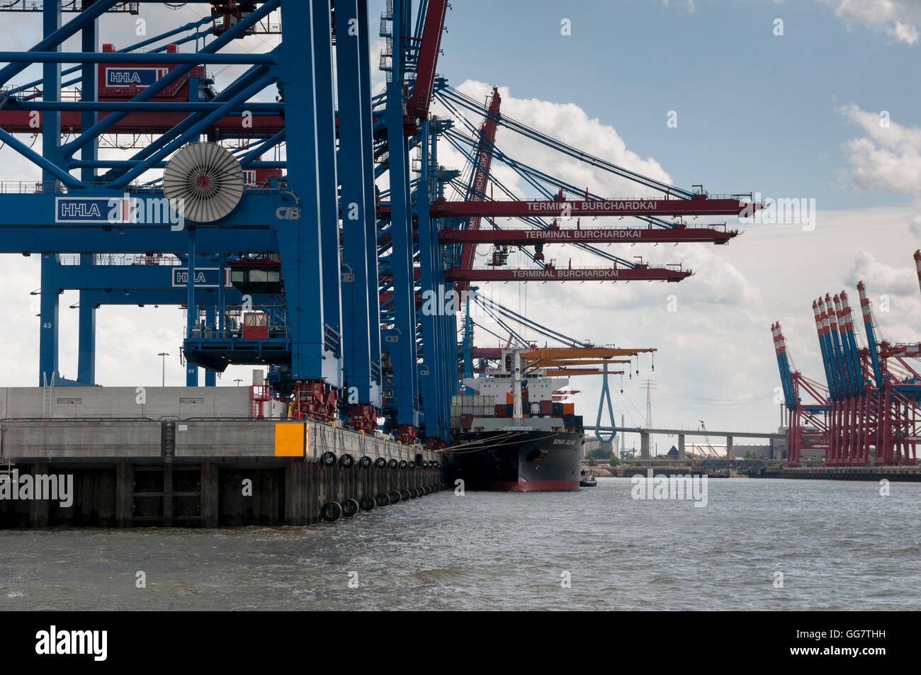 Hamburg, Germany. A container ship in the port of Hamburg is loaded ...