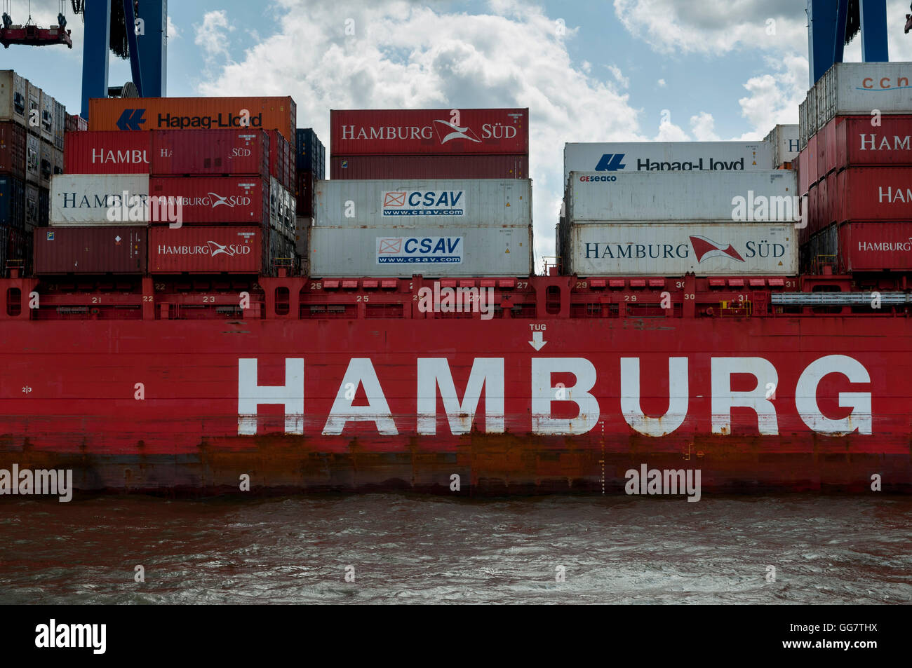 Hamburg, Germany. A container ship in the port of Hamburg is loaded ...