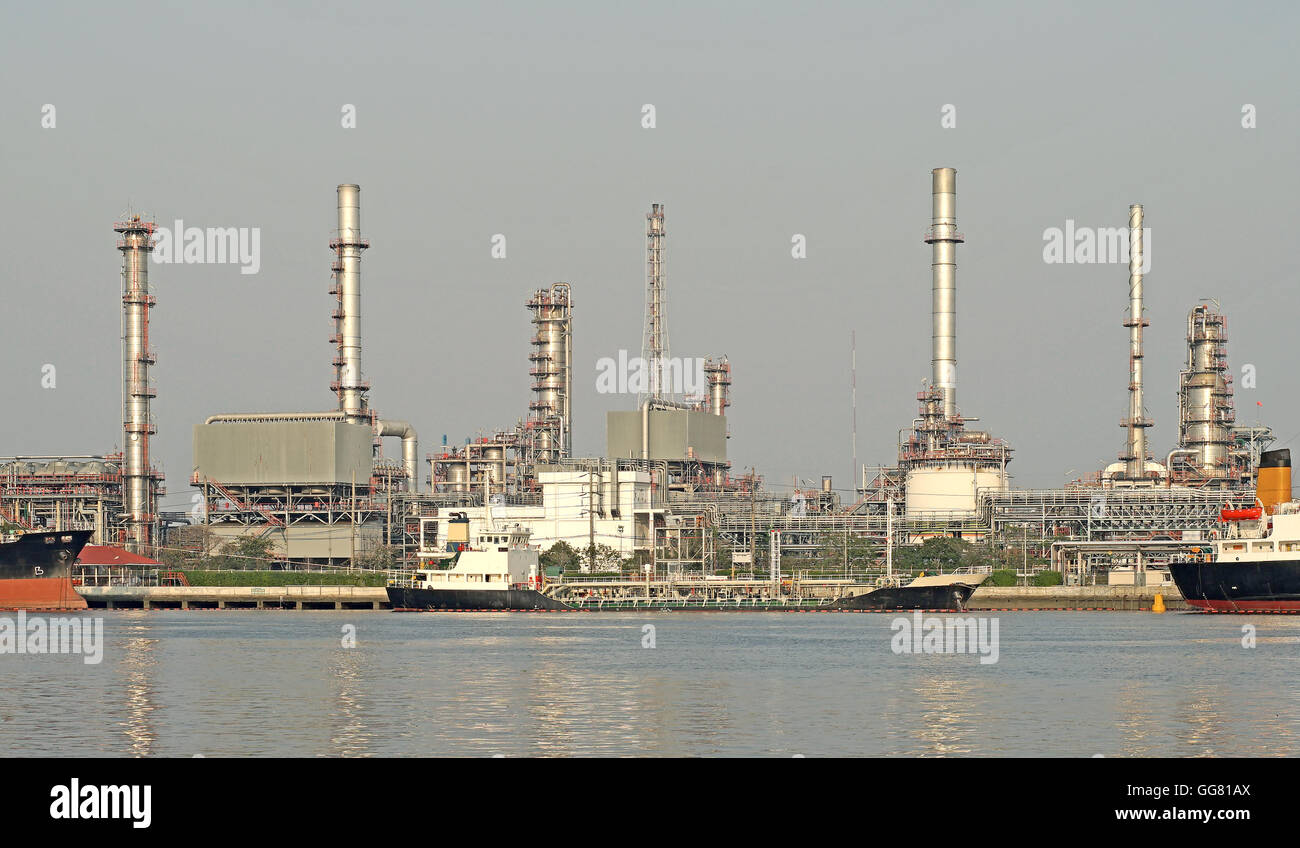 oil refinery along the river at day time Stock Photo - Alamy