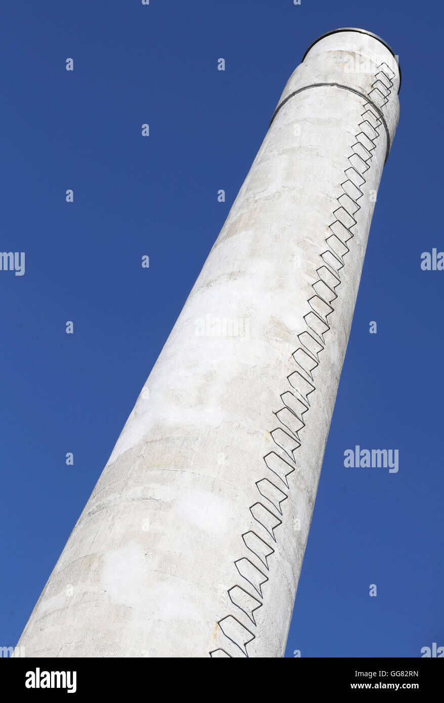 high reinforced concrete chimney by a modern factory Stock Photo - Alamy