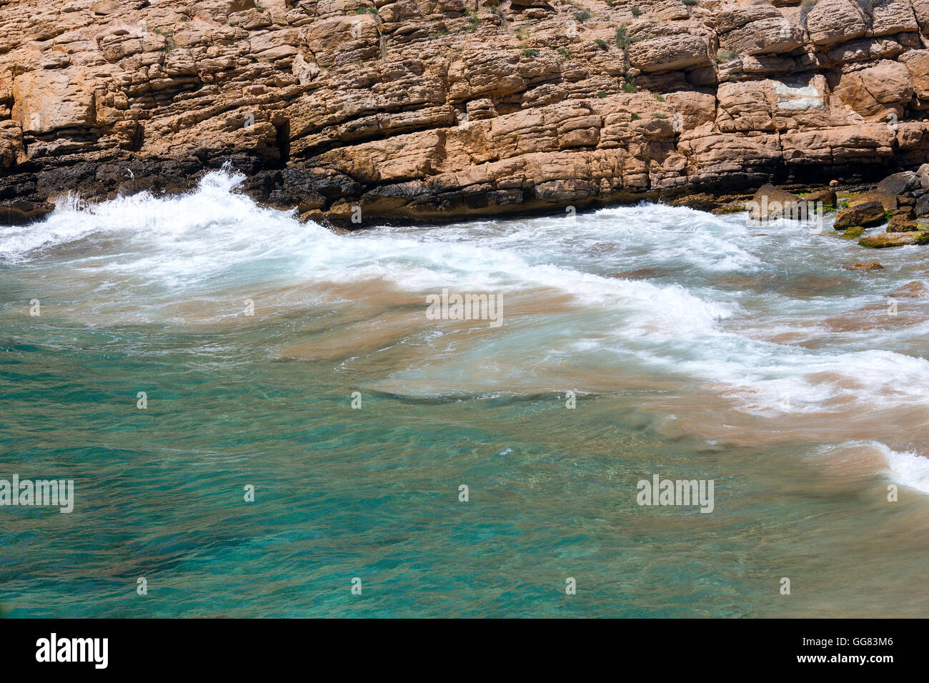 Waves breaking on rocky coast. View from above Stock Photo - Alamy