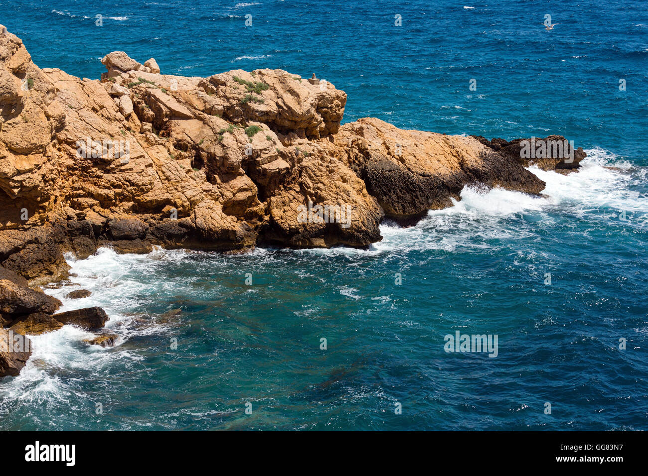Waves breaking on rocky coast. View from above Stock Photo - Alamy
