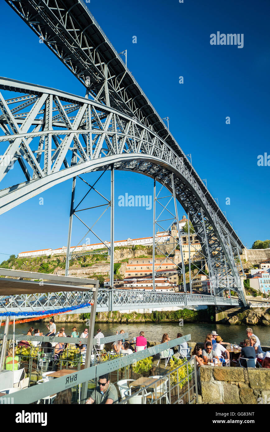 outdoor terrace bar cafe and landmark bridge in ribeira riverside area ...