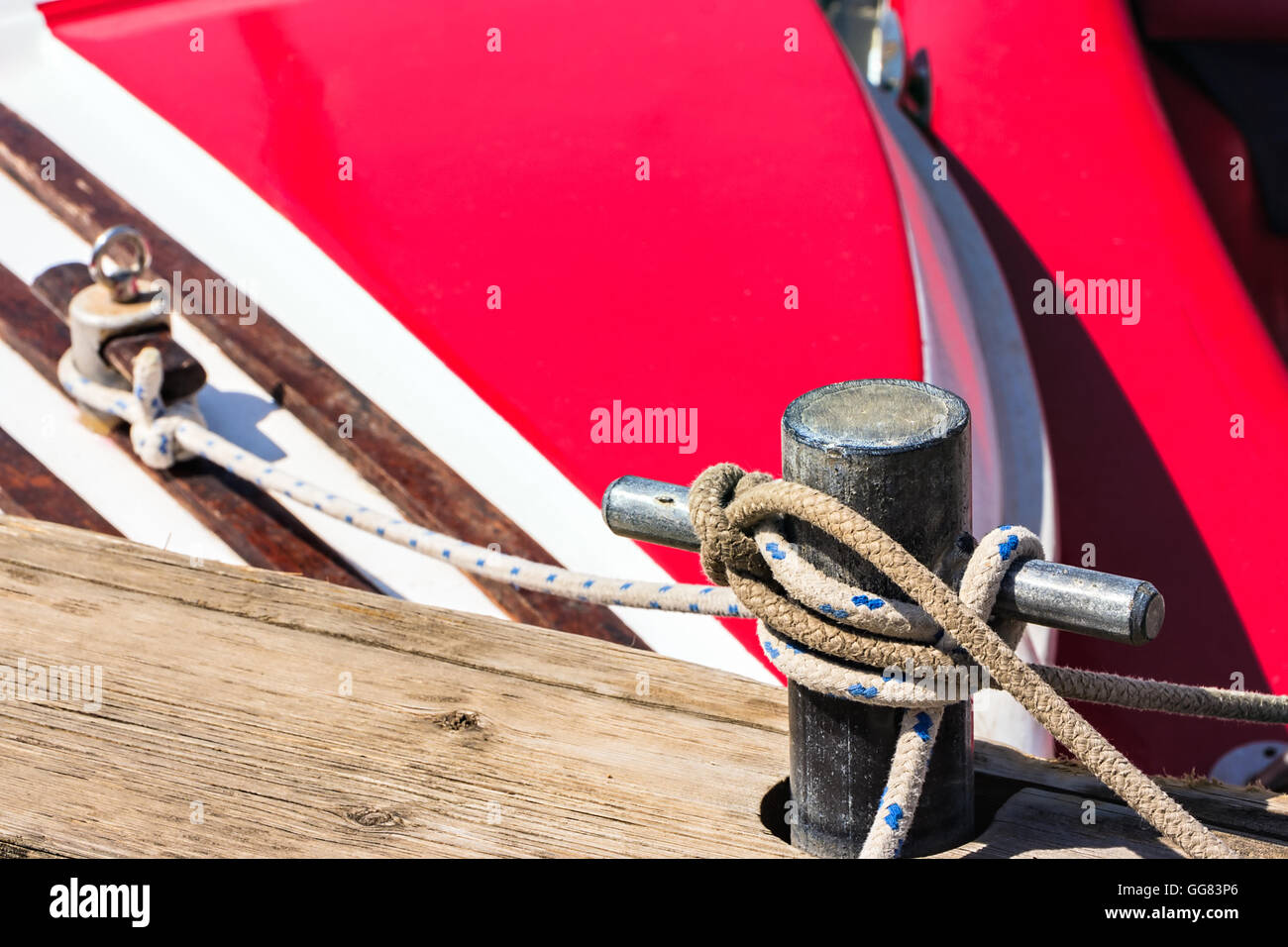 Boat tied with a rope in the port. Horizontal image Stock Photo - Alamy