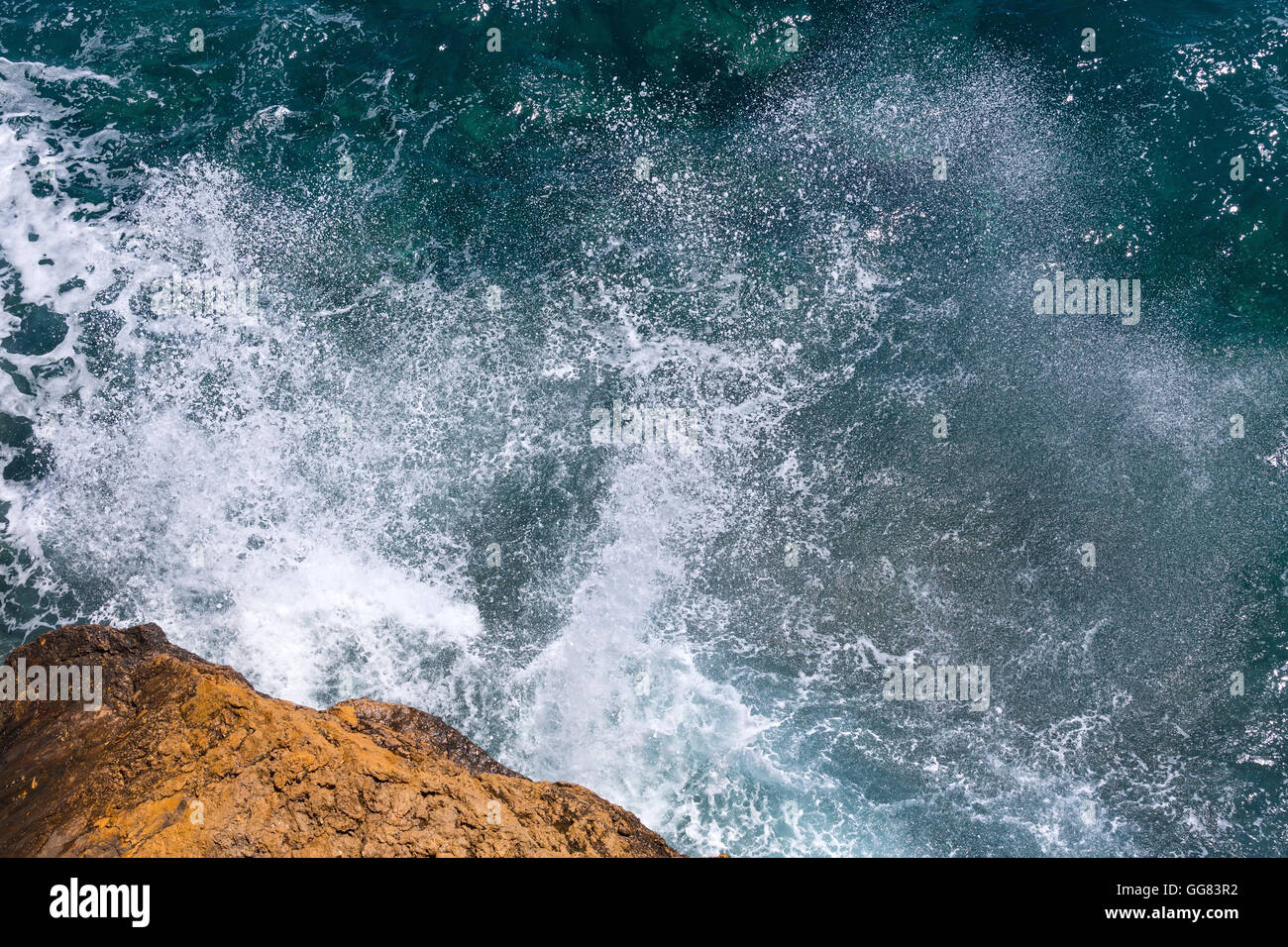 Waves breaking on rocky coast. View from above Stock Photo - Alamy