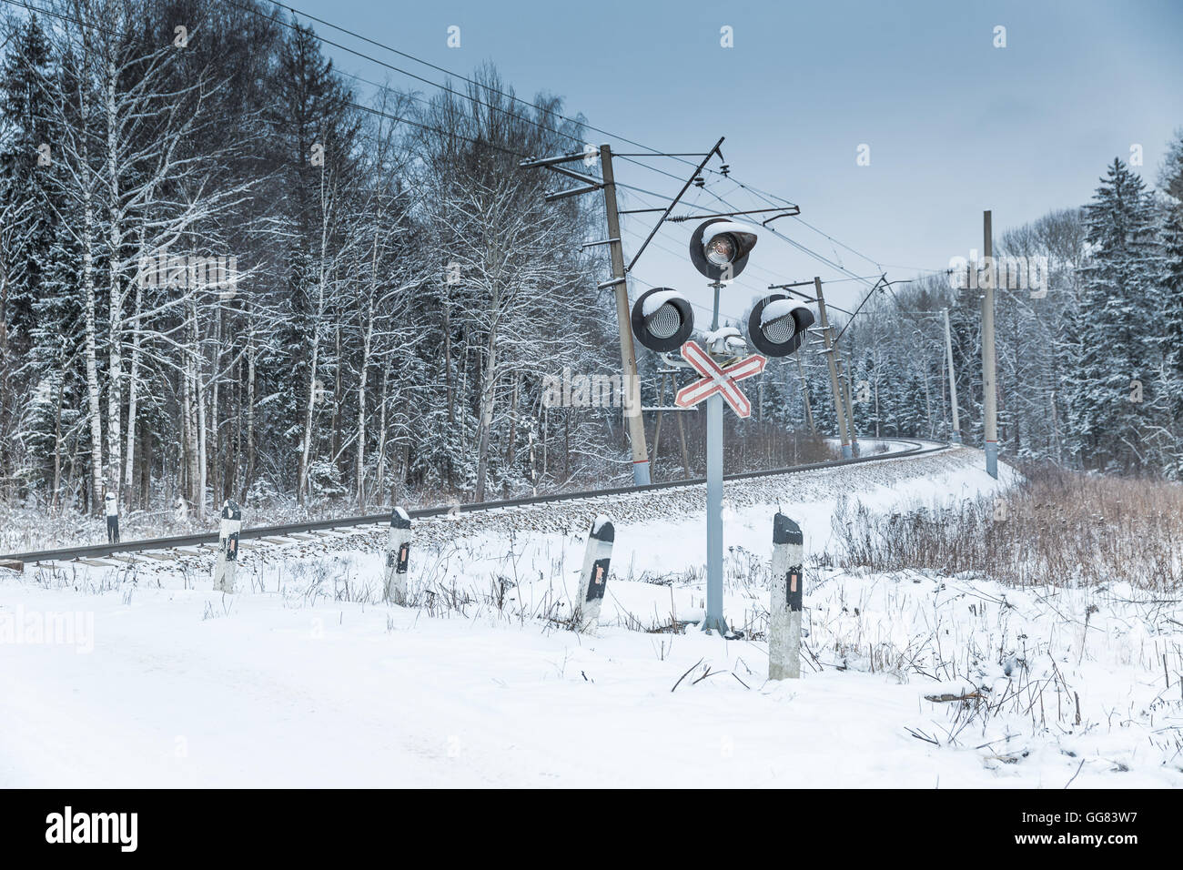 Snow covered railway crossing Stock Photo - Alamy