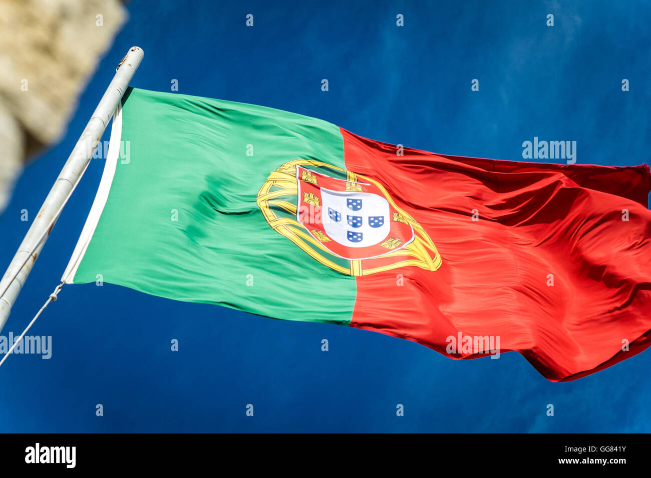Portugal flag flying on the Lisbon castle tower Stock Photo - Alamy