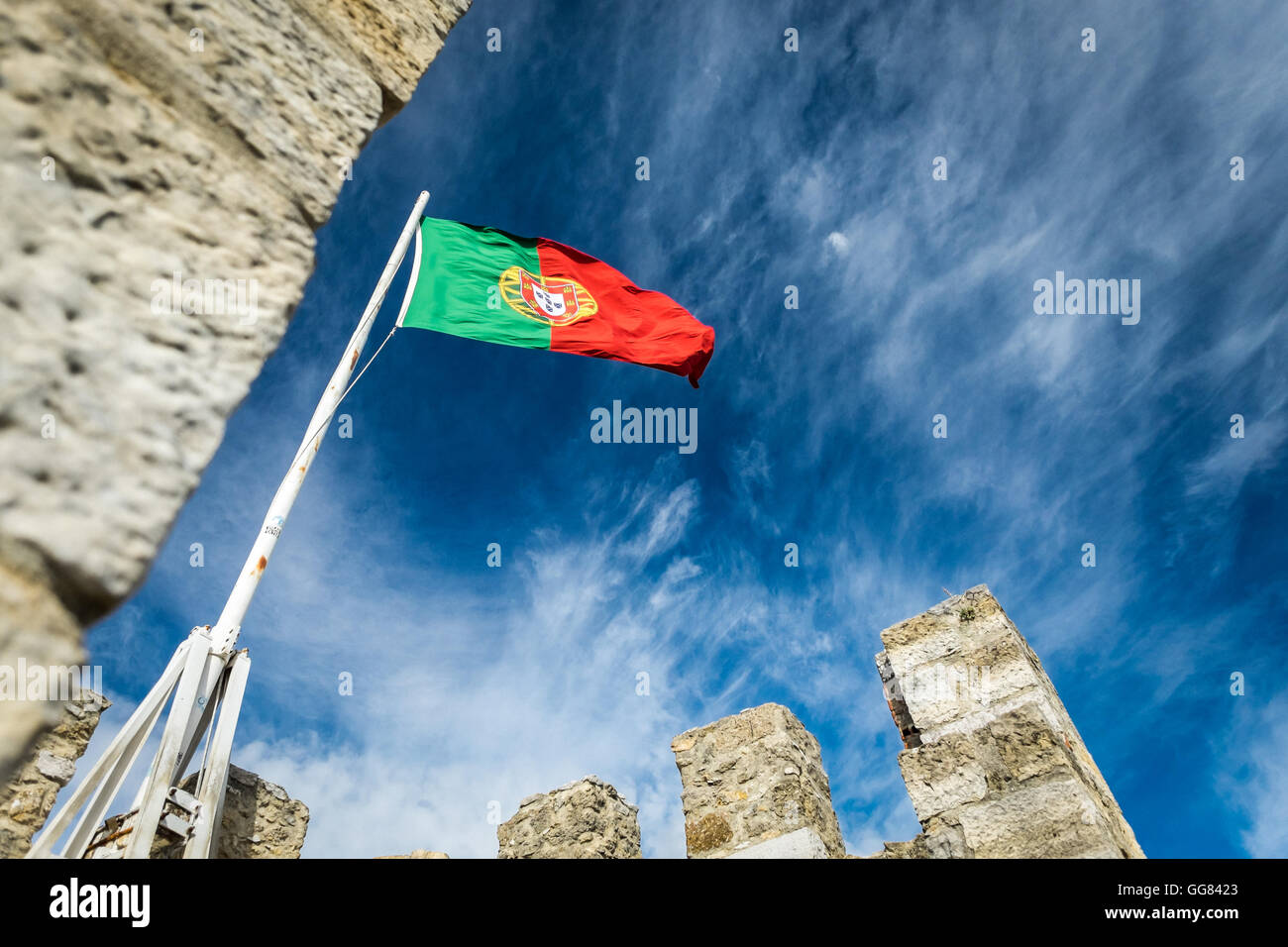 Portugal flag flying on the Lisbon castle tower Stock Photo - Alamy