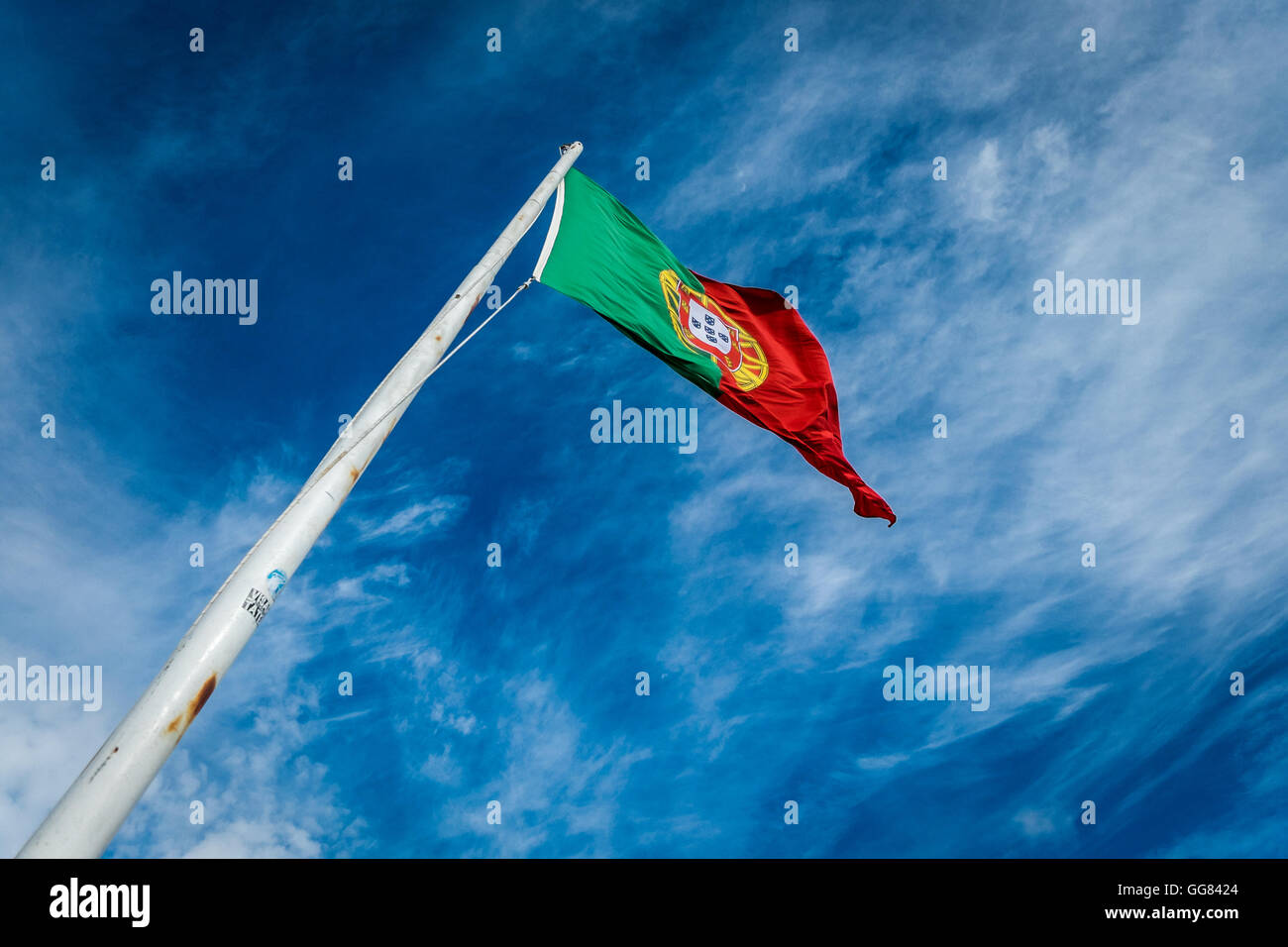 Portugal flag flying on the Lisbon castle tower Stock Photo - Alamy