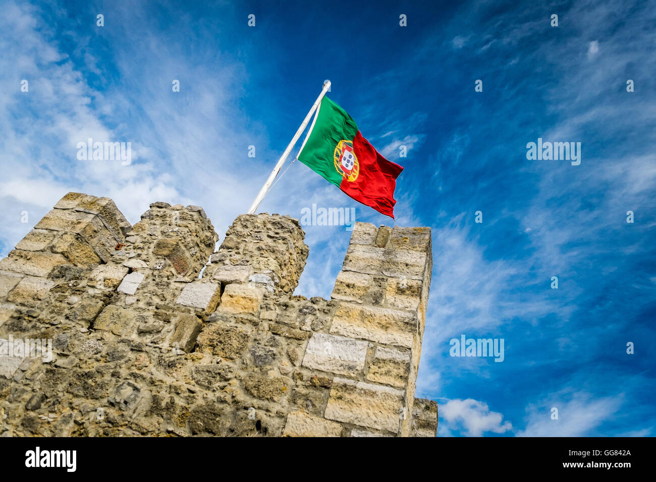 Portugal flag flying on the Lisbon castle tower Stock Photo - Alamy